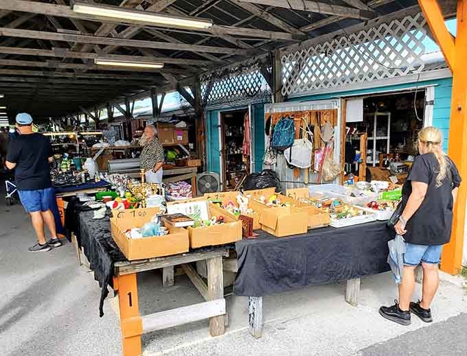 Weathered wood and turquoise accents give this outdoor section a beachy charm that makes bargain hunting feel like a vacation.