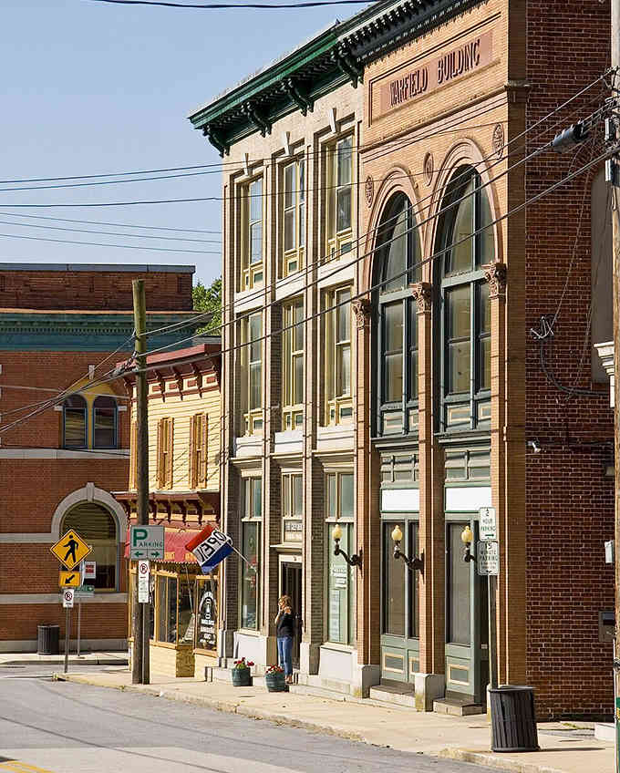 These restored Victorian storefronts in Sykesville stand shoulder to shoulder, their ornate details catching golden afternoon sunlight perfectly.