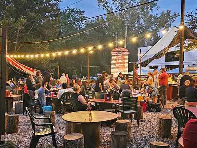 String lights dance above picnic tables where summer evenings stretch as long as the perfectly grilled seafood platters.