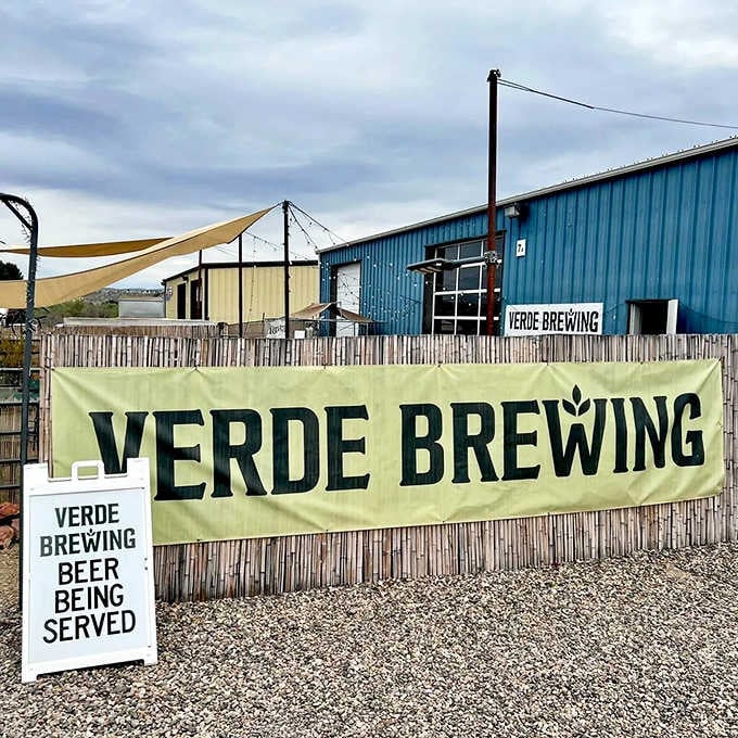 The industrial metal building with shade sails proves great beer doesn't need fancy packaging to taste amazing.