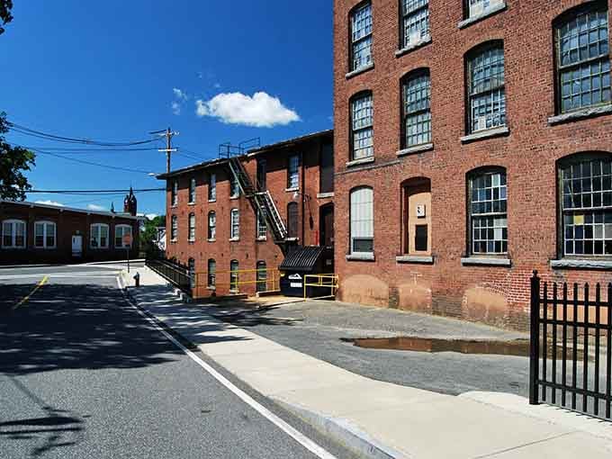 Those massive mill windows once lit entire factories, now they frame a quieter chapter in this town's story.