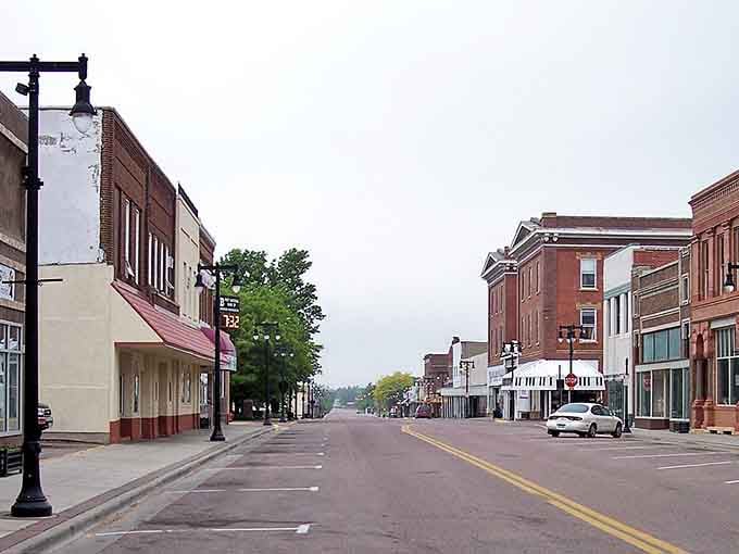 Solid brick construction and green awnings signal a business district built to last through changing times.