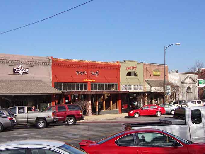 The red storefront pops against its neighbors, proving that even small-town main streets can have big personality and style.
