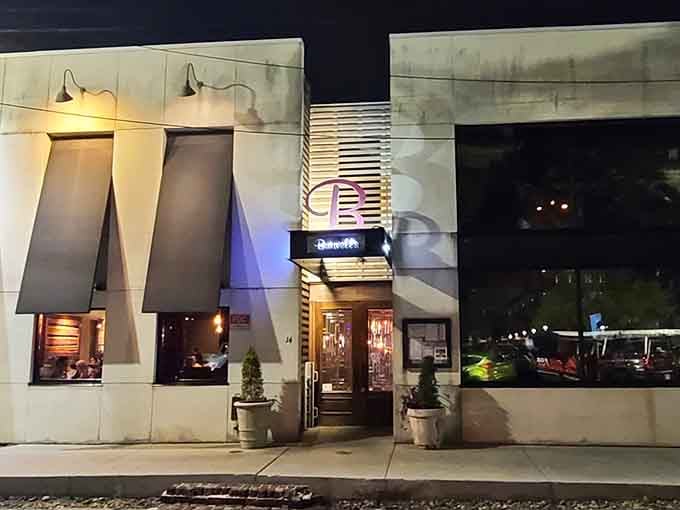 Evening transforms this contemporary facade into a glowing invitation, with dramatic lighting that would make any architect proud.