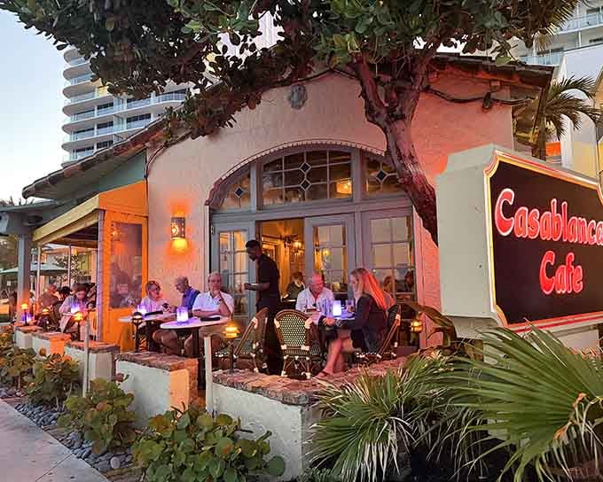 Golden hour transforms this romantic spot into something magical where that iconic tree grows right through the building.