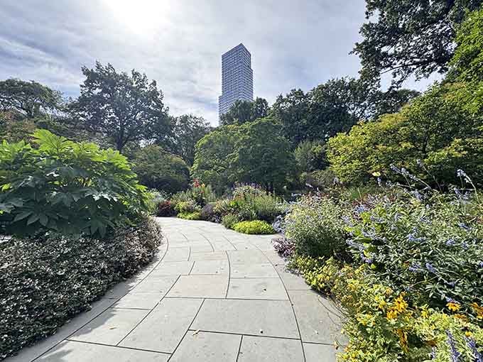 This winding garden path invites peaceful strolls through blooms that would make any English gardener green with envy.