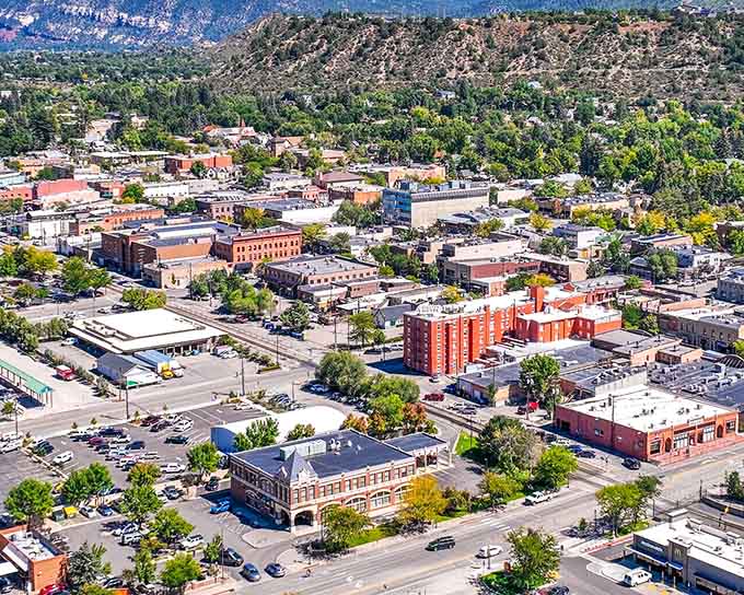 From above, the town spreads like a quilt across the valley, stitched together by tree-lined streets.
