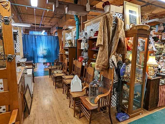 Wooden floors lead through curated displays where every corner reveals another layer of carefully collected vintage treasures.