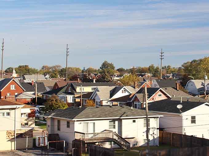 Modest rooftops stretch toward the horizon like a patchwork quilt of affordable housing and honest working-class neighborhoods.