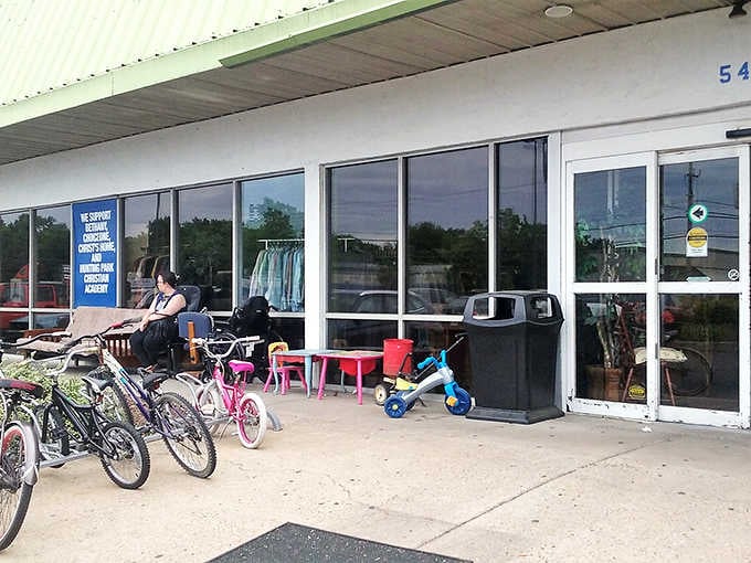 Bikes and furniture spill onto the sidewalk like a preview of coming attractions for the bargain show inside.