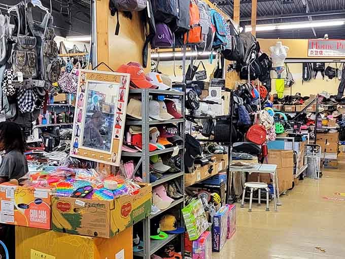 Caps and bagpacks tower overhead in this bustling corridor where finding that perfect item feels like winning the lottery.