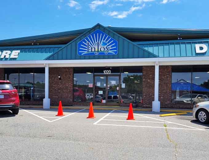 The cheerful blue sunrise logo above the entrance promises a bright new day for your wallet and your wardrobe.