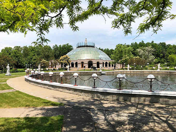 This domed pavilion sits beside reflecting pools like a jewel box someone placed in a park for everyone to enjoy.