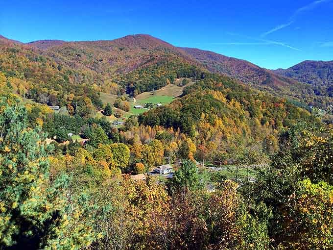 Fall colors blanket the hillsides in layers of orange and gold, turning this mountain valley into autumn's greatest masterpiece.