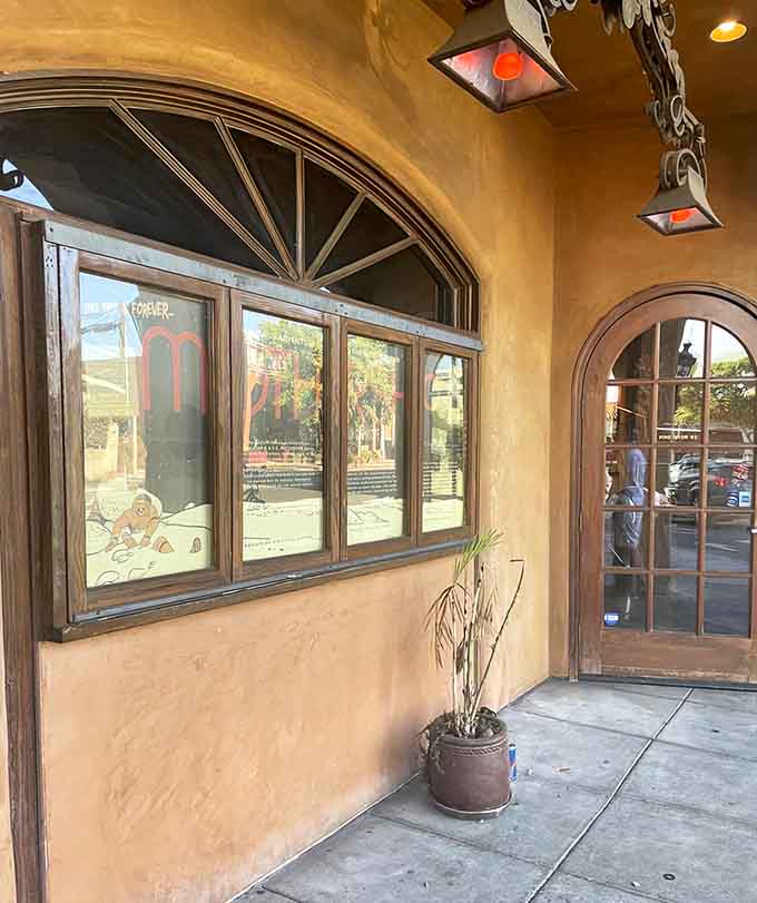 Those arched doorways and rustic details create an inviting entrance to Dante-inspired dining done with California flair.