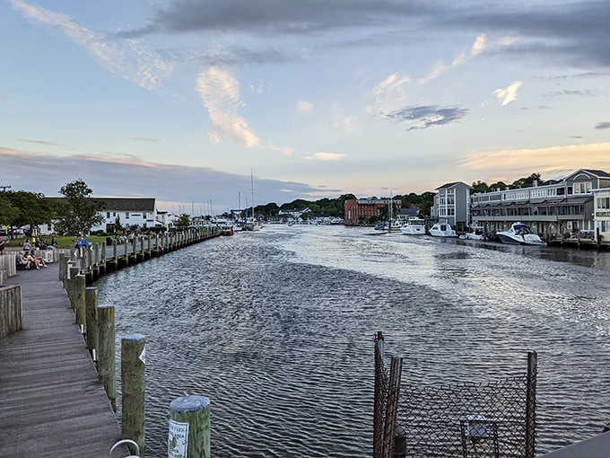 Evening light turns the waterway golden while boats rest peacefully after a day on the water.