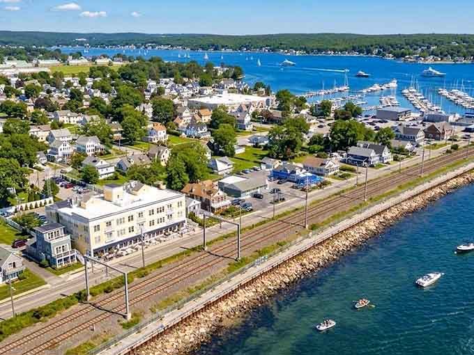 Niantic's coastline stretches endlessly, where railroad tracks and ocean waves create the perfect soundtrack for summer vacation dreams.