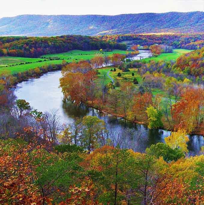 Fall foliage explodes in technicolor glory along the valley, proving Mother Nature is the ultimate artist.