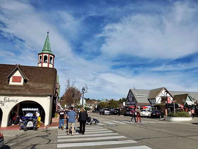 Families stroll past these charming Danish-style buildings where Old World architecture creates a fairy-tale atmosphere in sunny California.