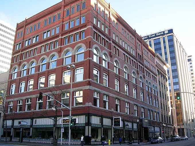 This red brick beauty with arched windows stands proud among newer buildings, a testament to architectural staying power.