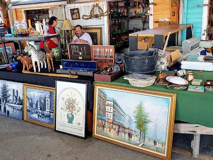 Vintage paintings and eclectic treasures pile high on these tables, each item whispering stories from someone else's interesting past.