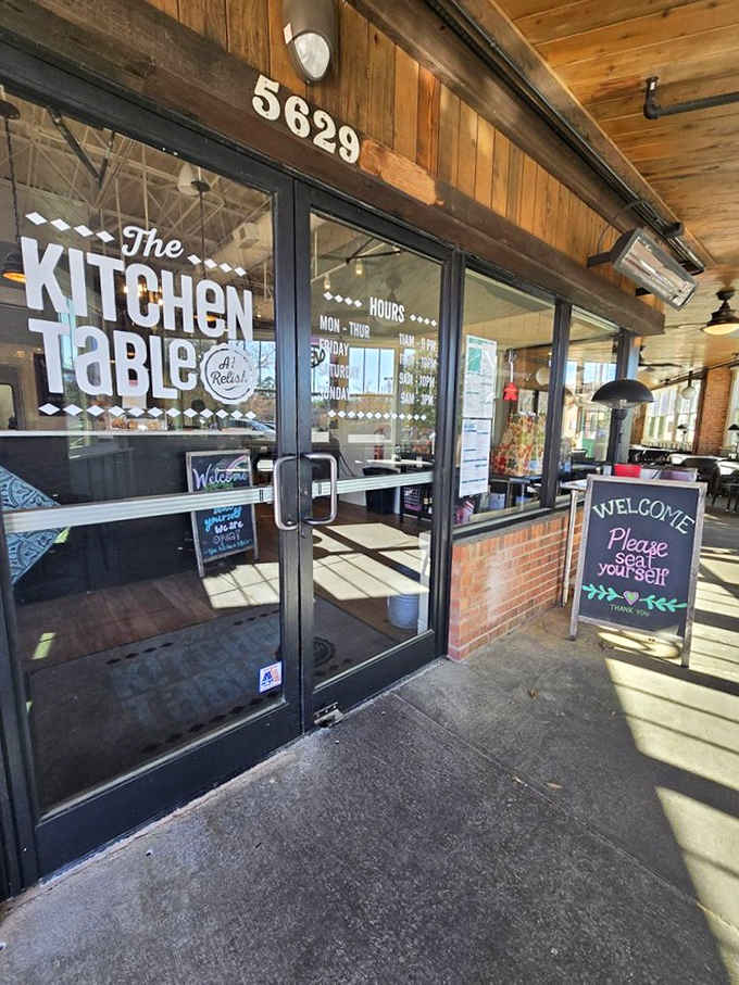 Rustic wood and modern glass blend beautifully, creating that perfect farmhouse-meets-contemporary dining space.