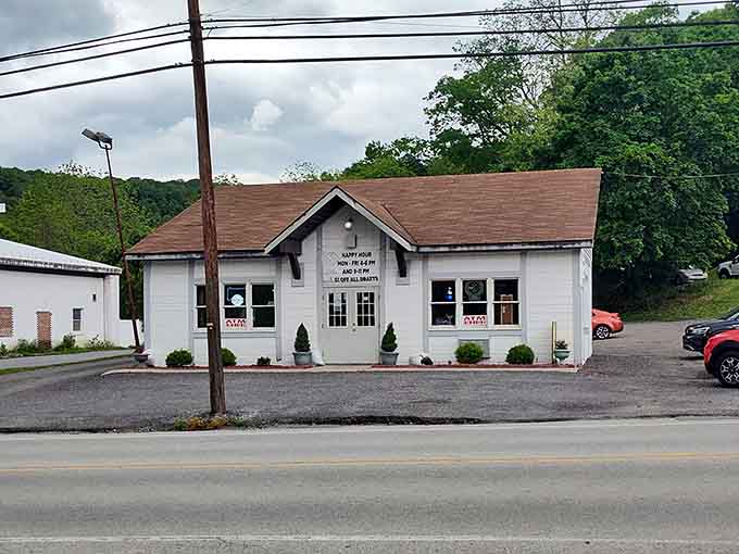 That classic roadside sign and white building look like something from a simpler time when diners mattered most.