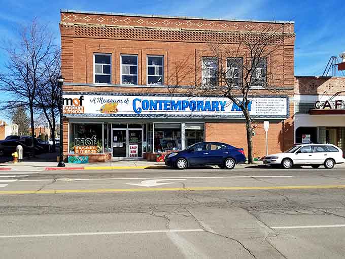 This brick storefront museum invites curiosity with windows that promise stories from generations past waiting to be discovered inside.