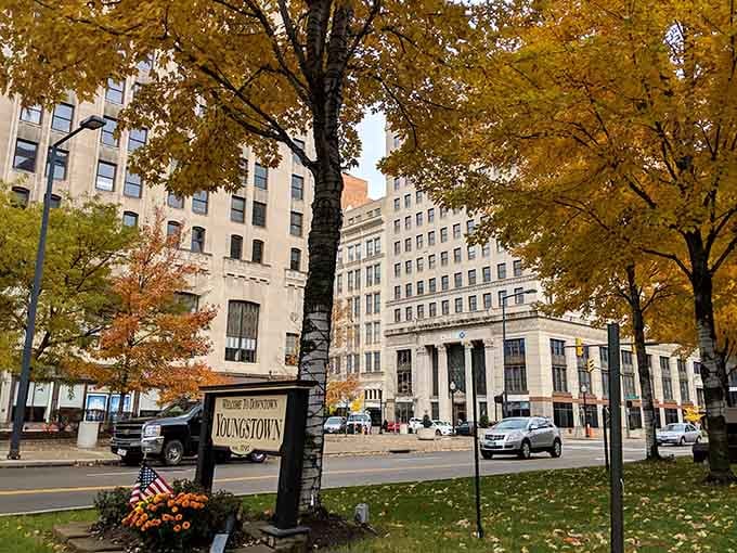 Golden autumn leaves frame the downtown welcome sign like nature's own way of saying "you're going to like it here."