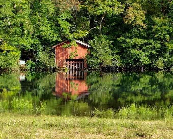 This boathouse reflection is so perfect, even Monet would put down his brush and just stare appreciatively.