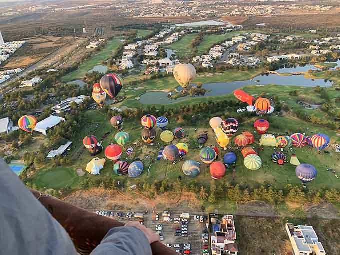 When dozens of balloons gather for a festival, you realize you're not just flying&mdash;you're part of a floating rainbow parade.