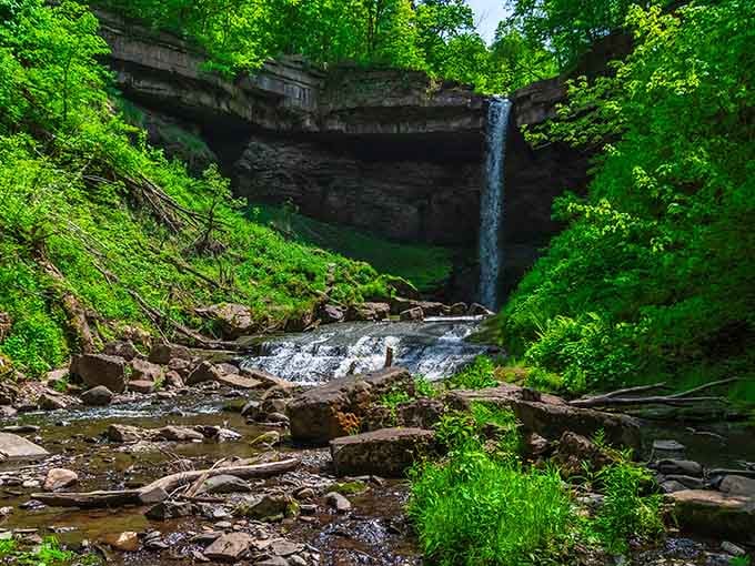 When a 90-foot waterfall drops into a moss-covered amphitheater, Mother Nature's basically showing off her architectural degree.