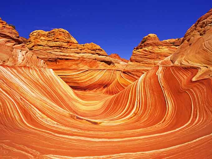 Those swirling orange ribbons aren't a screensaver; they're actual rocks that'll make your brain short-circuit with wonder.
