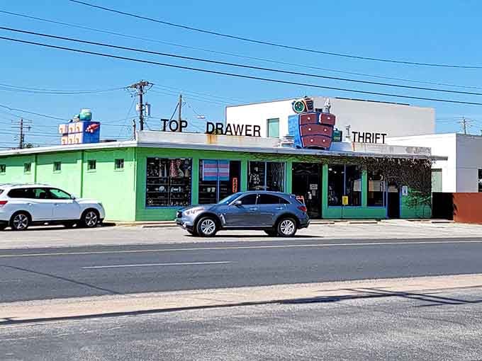 That cheerful green exterior and whimsical rooftop dresser sculpture promise vintage adventures await inside this Austin treasure trove.