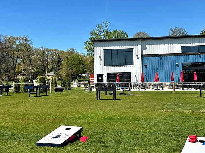 The modern barn aesthetic meets family paradise, where sprawling green space promises freedom for restless little legs.