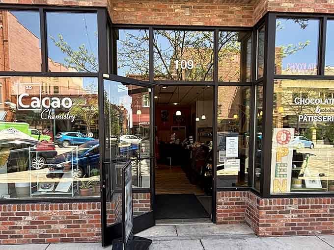 That brick facade and welcoming doorway promise chocolate treasures that'll make your heart skip a beat.