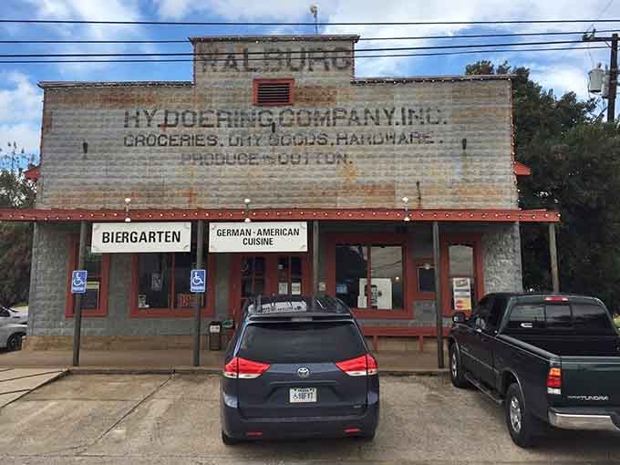That weathered stone facade and vintage signage aren't just for show &ndash; this is authentic Hill Country history with schnitzel.