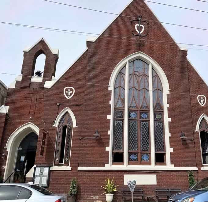 Gothic arches and red brick meet modern dining in this stunning architectural conversion that proves sacred spaces make spectacular restaurants.