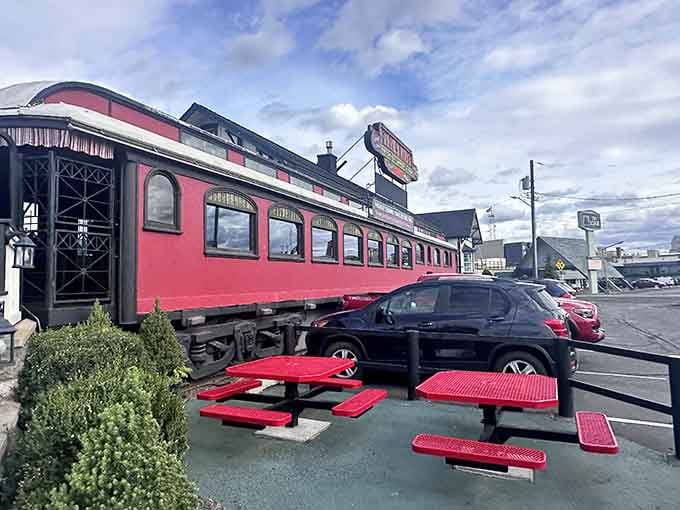 The red exterior practically glows with vintage charm, promising pancakes and a side of railroad history inside.