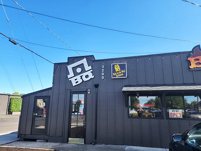 When the "OPEN" sign glows red against that blue sky, you know someone's firing up magic in the smoker.