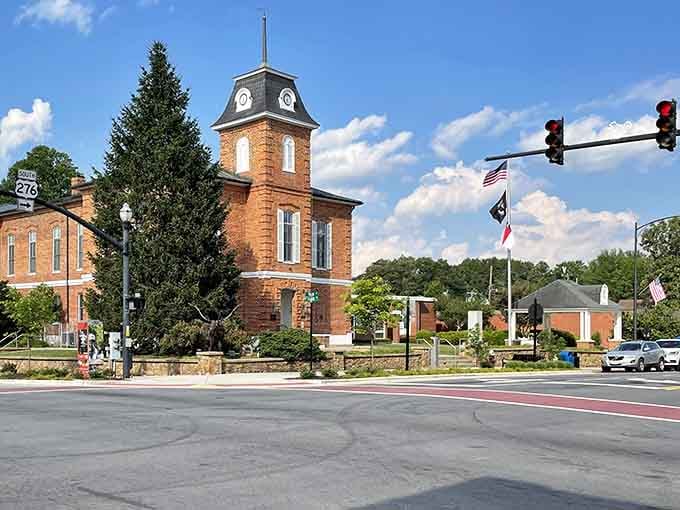 Main Street Brevard stretches out like a postcard from a simpler time, mountains watching over brick buildings.