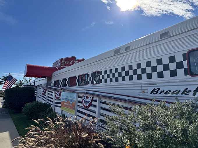 The patriotic bunting and chrome details prove this train car takes its diner duties seriously under California's perfect sky.