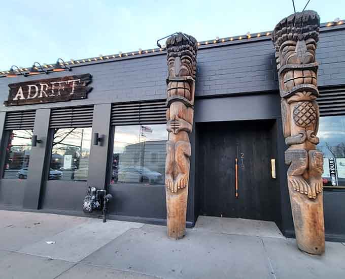 Those tiki guardians aren't just for show; they're your first hint that reality ends at this doorstep.