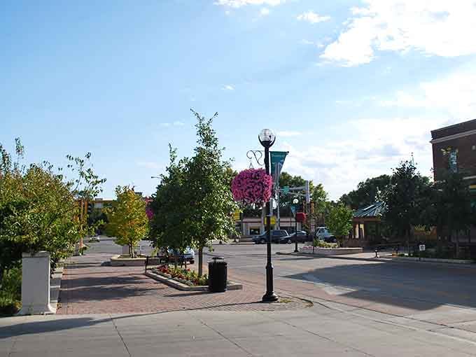 Downtown Moorhead blooms with hanging baskets and tree-lined streets where affordability meets genuine Midwestern charm beautifully.