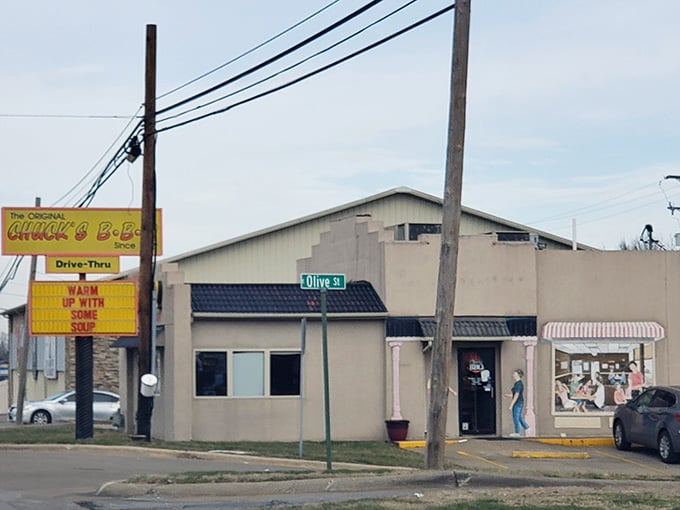 That yellow sign has been beckoning barbecue lovers like a smoky siren song for generations of hungry travelers.