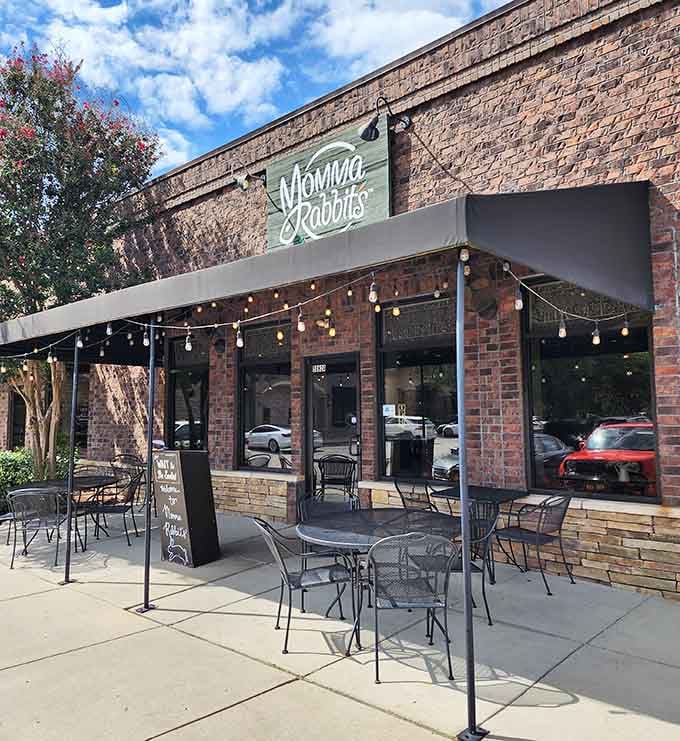 That charming brick facade and twinkling patio lights promise the kind of meal worth canceling other plans for.