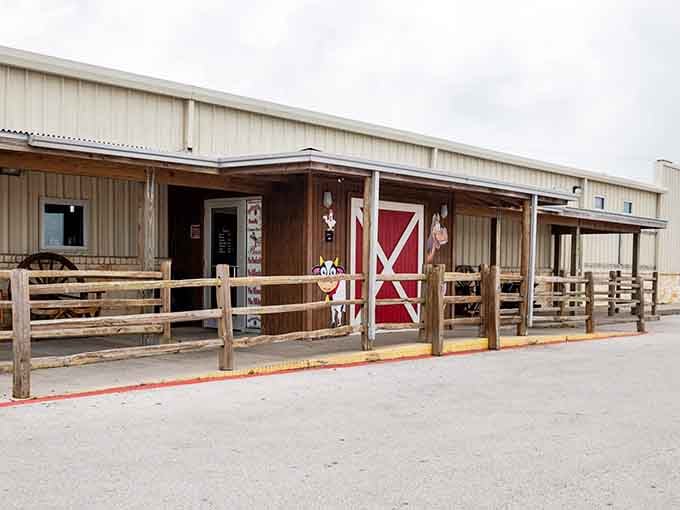 That rustic barn-style entrance promises serious country cooking, and those wooden corrals aren't just for show.