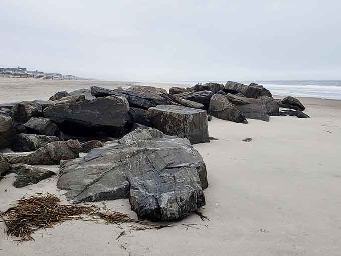 Ancient boulders scattered across pristine sand like nature's own sculpture garden, waiting to be discovered.