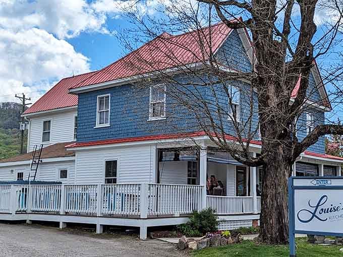 That blue house with the red roof isn't just charming, it's where breakfast dreams come true every single day.