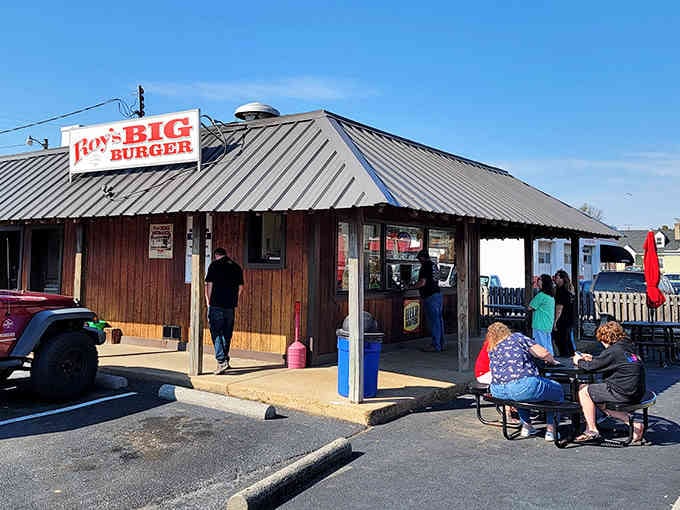 Classic roadside architecture meets serious burger business where locals have gathered for decades of delicious tradition.